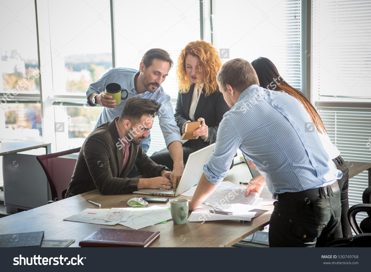 stock-photo-business-people-showing-team-work-while-working-in-board ...